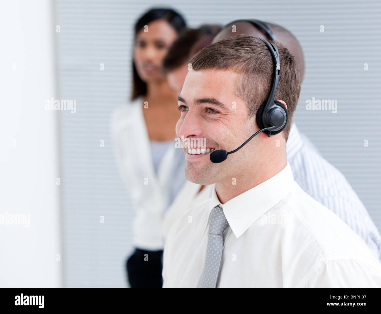 Confident customer service representatives standing in a line Stock ...