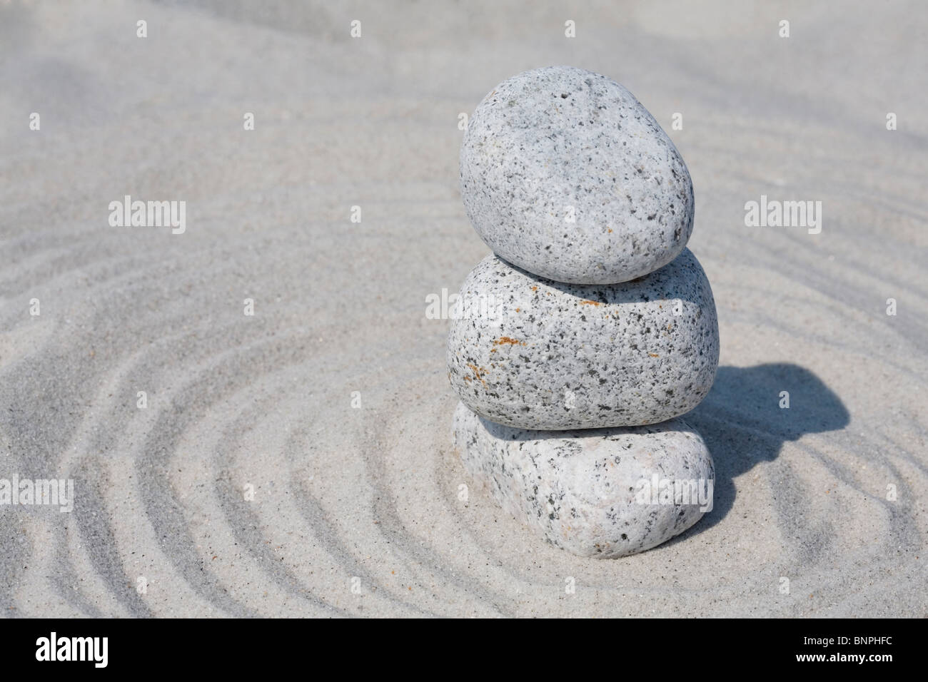 Stones piled in the sand Stock Photo - Alamy