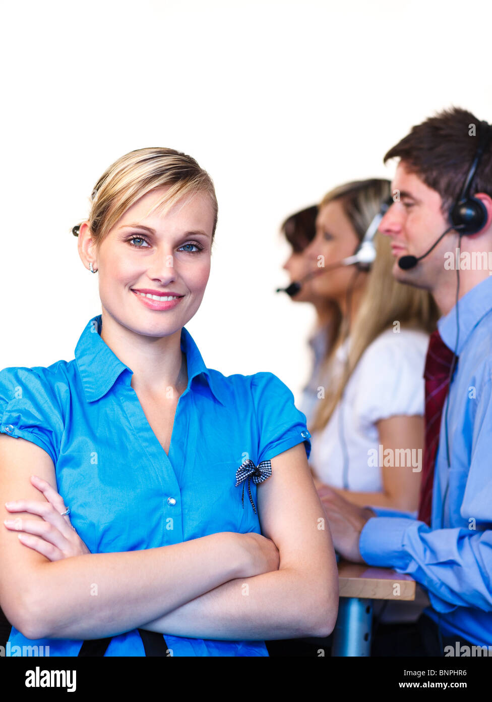 Blonde manager looking at the camera Stock Photo - Alamy