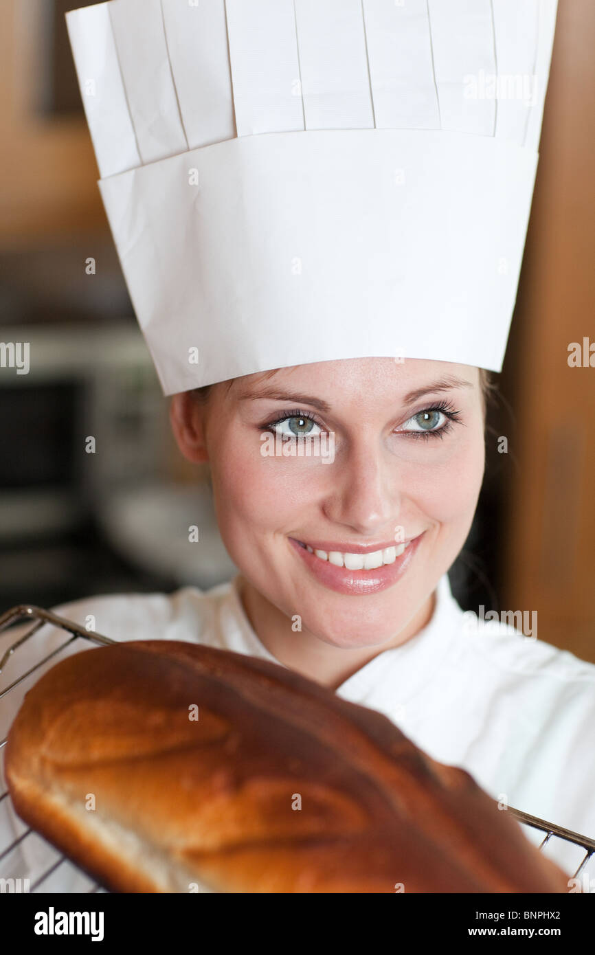 Confident female chef baking bread Stock Photo - Alamy