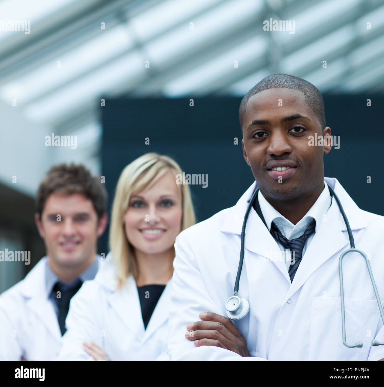 Portrait of a confident ethnic doctor Stock Photo - Alamy