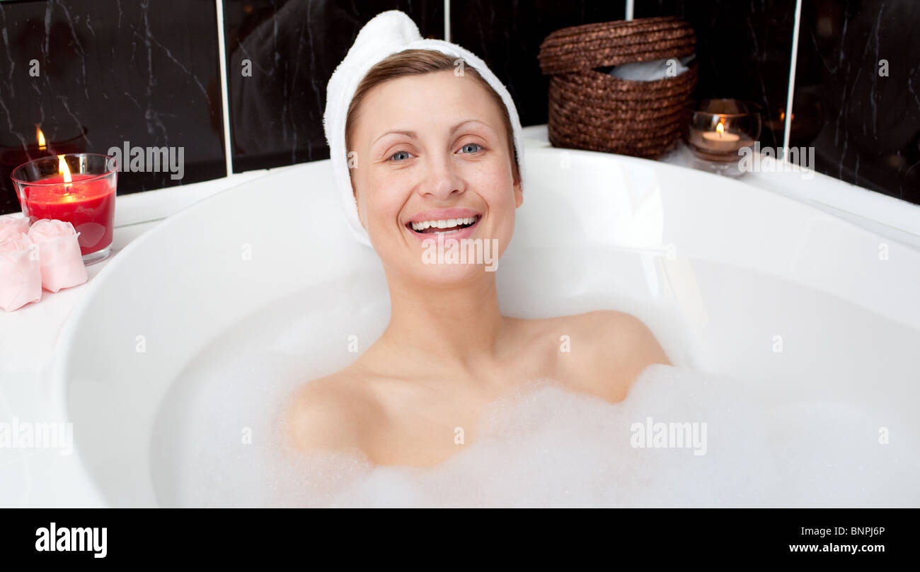 Cheerful attractive woman in a bubble bath Stock Photo - Alamy