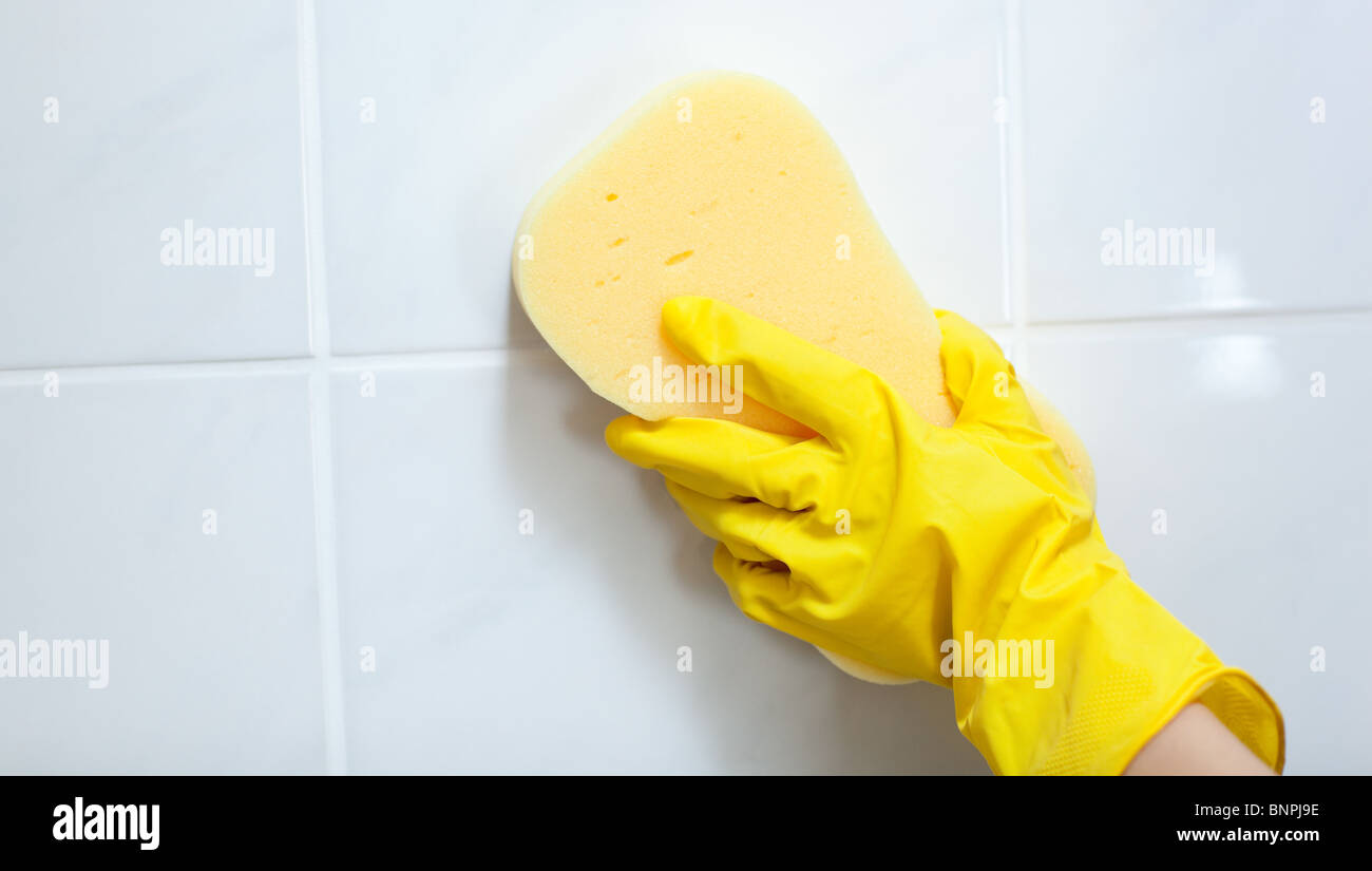 Close-up of a woman cleaning a bathroom Stock Photo - Alamy