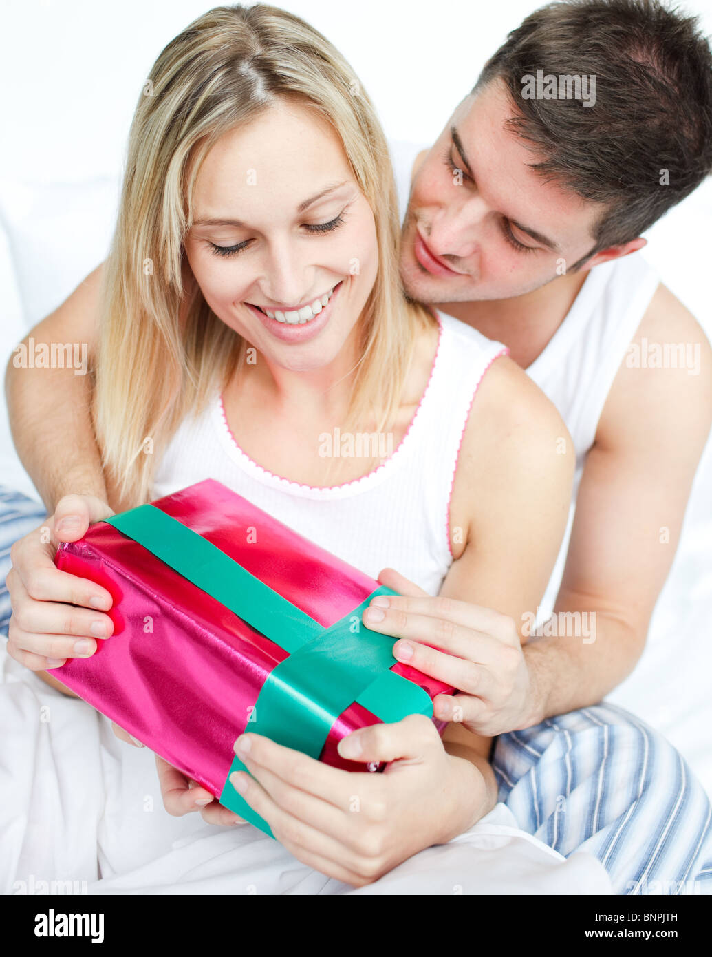 Boyfriend giving a gift to her girlfriend Stock Photo - Alamy