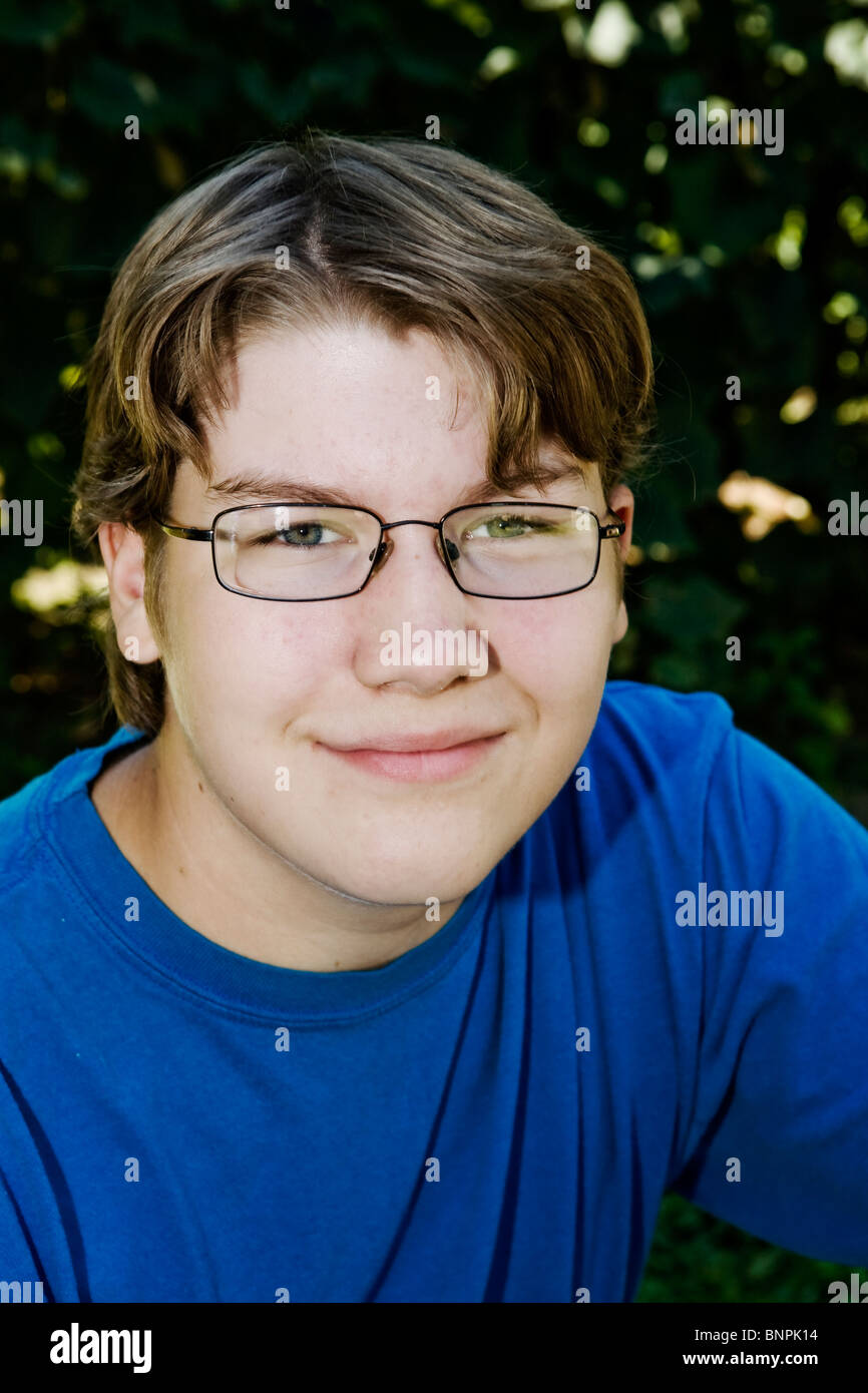 Portrait of a teen boy with glasses Stock Photo - Alamy