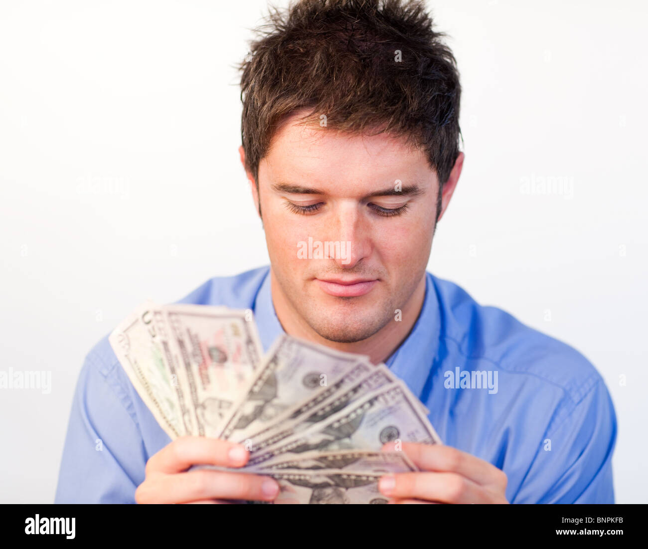 Handsome man counting dollars Stock Photo - Alamy