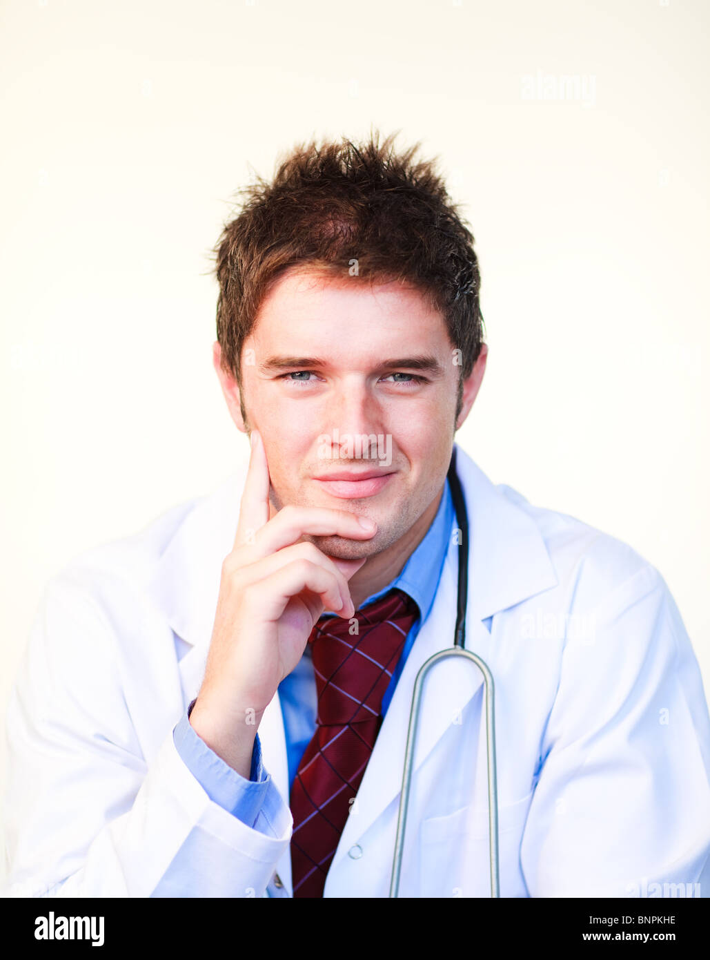 Friendly young doctor looking at the camera Stock Photo - Alamy