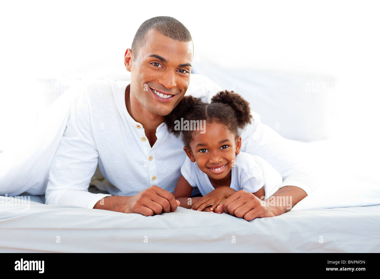 Caring father and his daughter smiling at the camera Stock Photo - Alamy