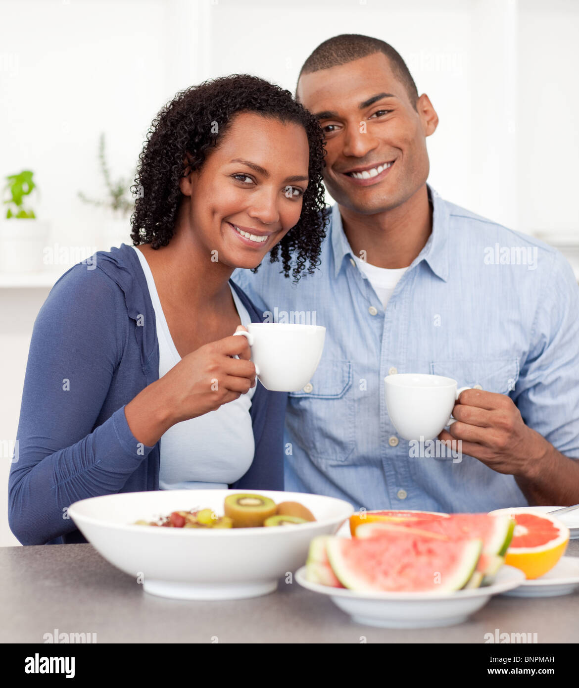 Portrait of an couple having breakfast Stock Photo - Alamy