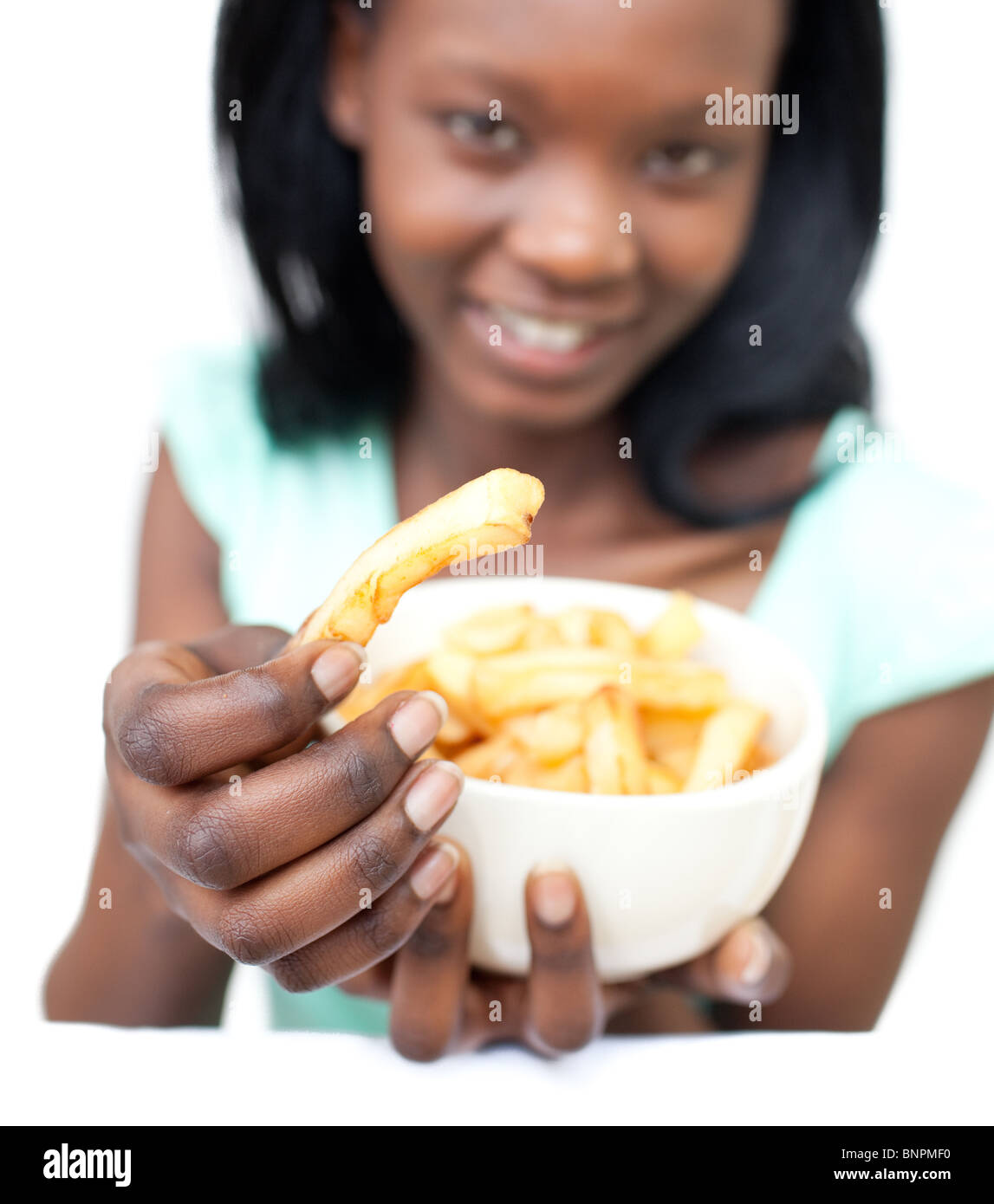 Pretty young woman eating fries Stock Photo - Alamy