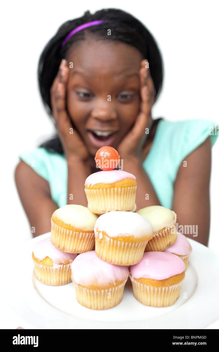 Astonished young woman looking at cakes Stock Photo - Alamy
