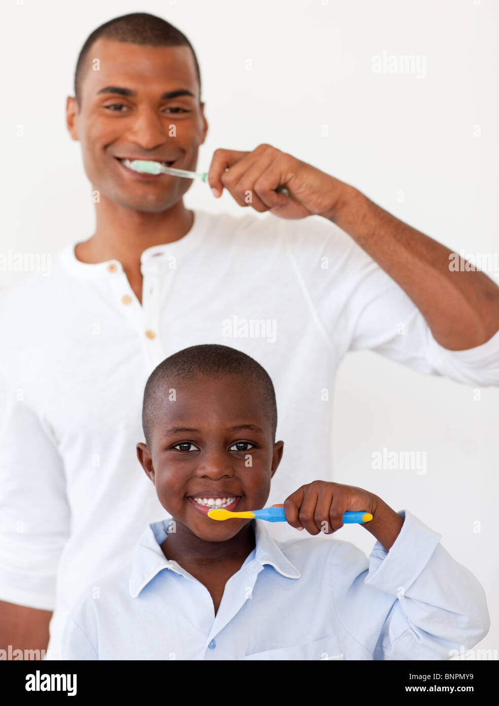 Father and his son brushing their teeth Stock Photo - Alamy