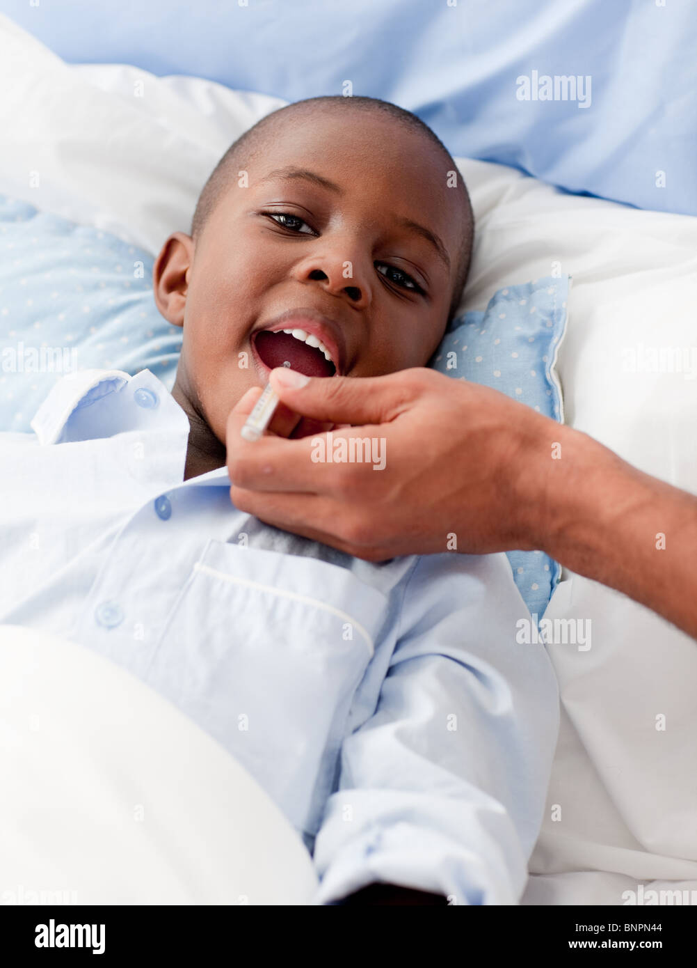 Small Boy sick in bed Stock Photo - Alamy