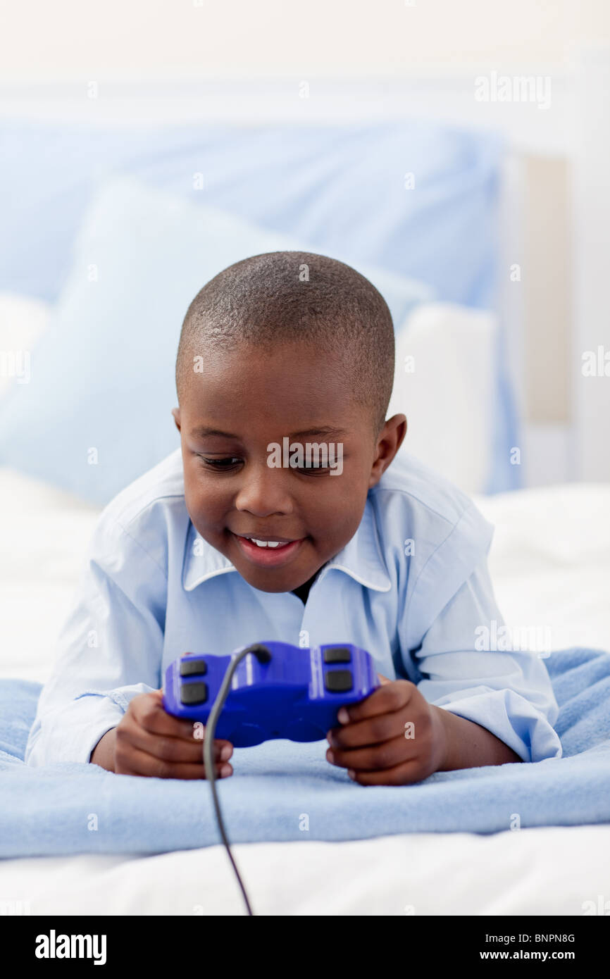 Little boy playing video game Stock Photo - Alamy