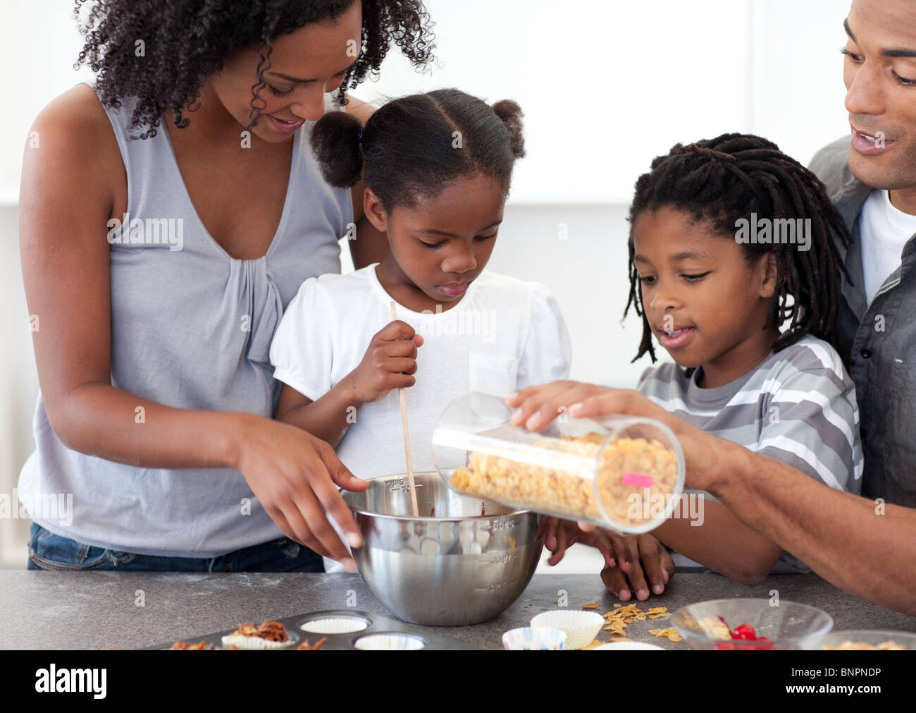 Family making biscuits together Stock Photo - Alamy
