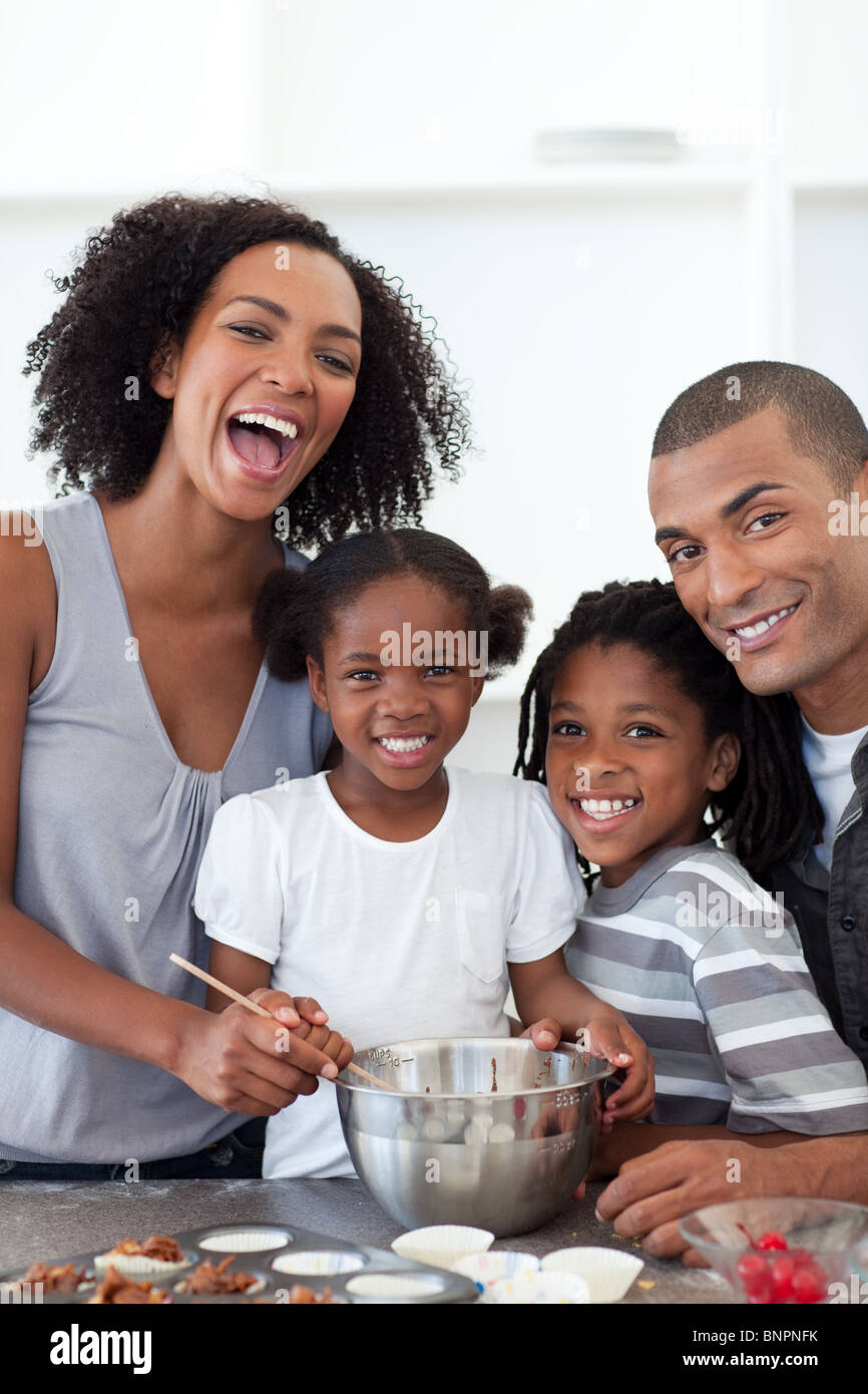 Jolly family making cookies together Stock Photo - Alamy