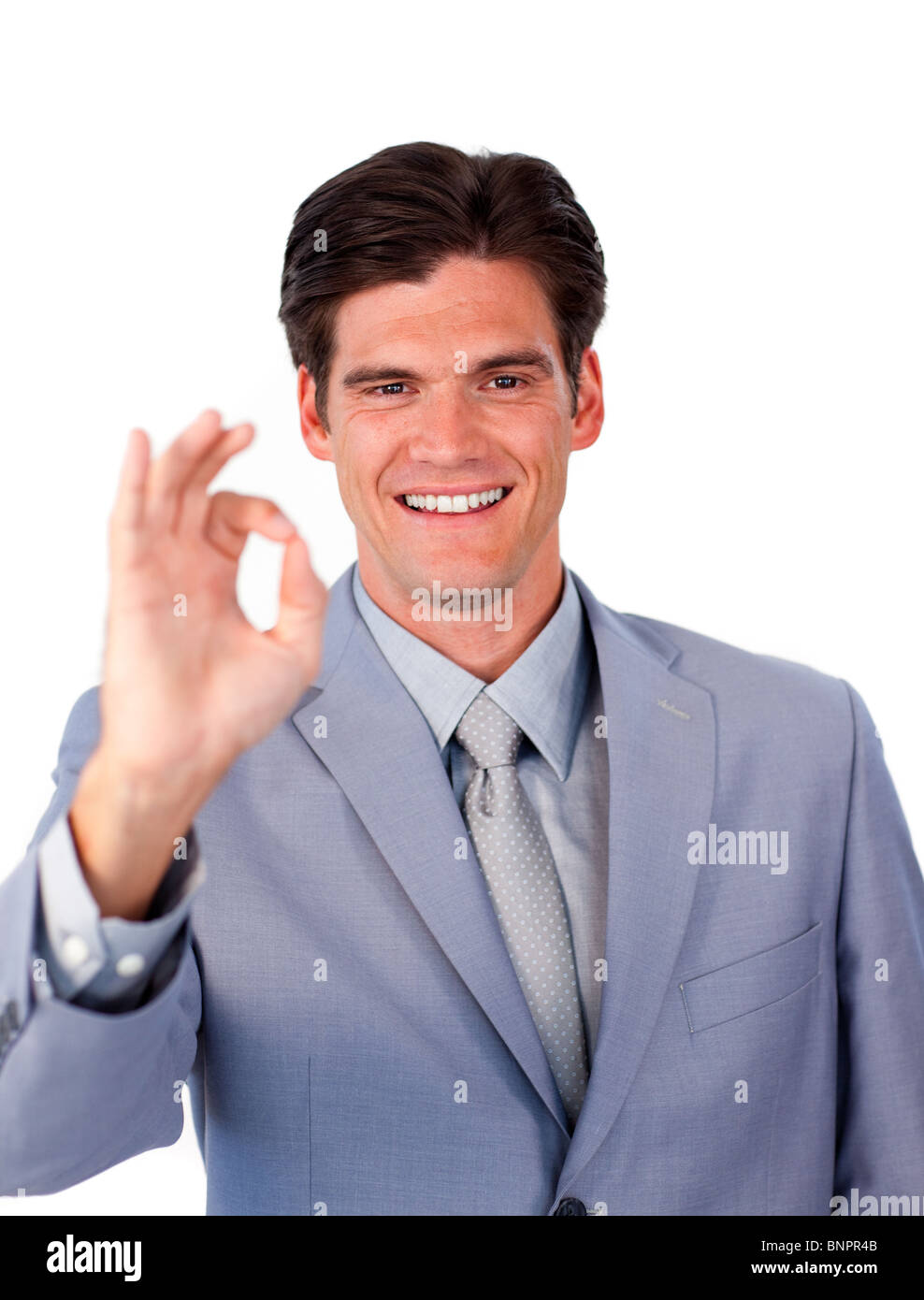 Successful businessman showing OK sign Stock Photo - Alamy