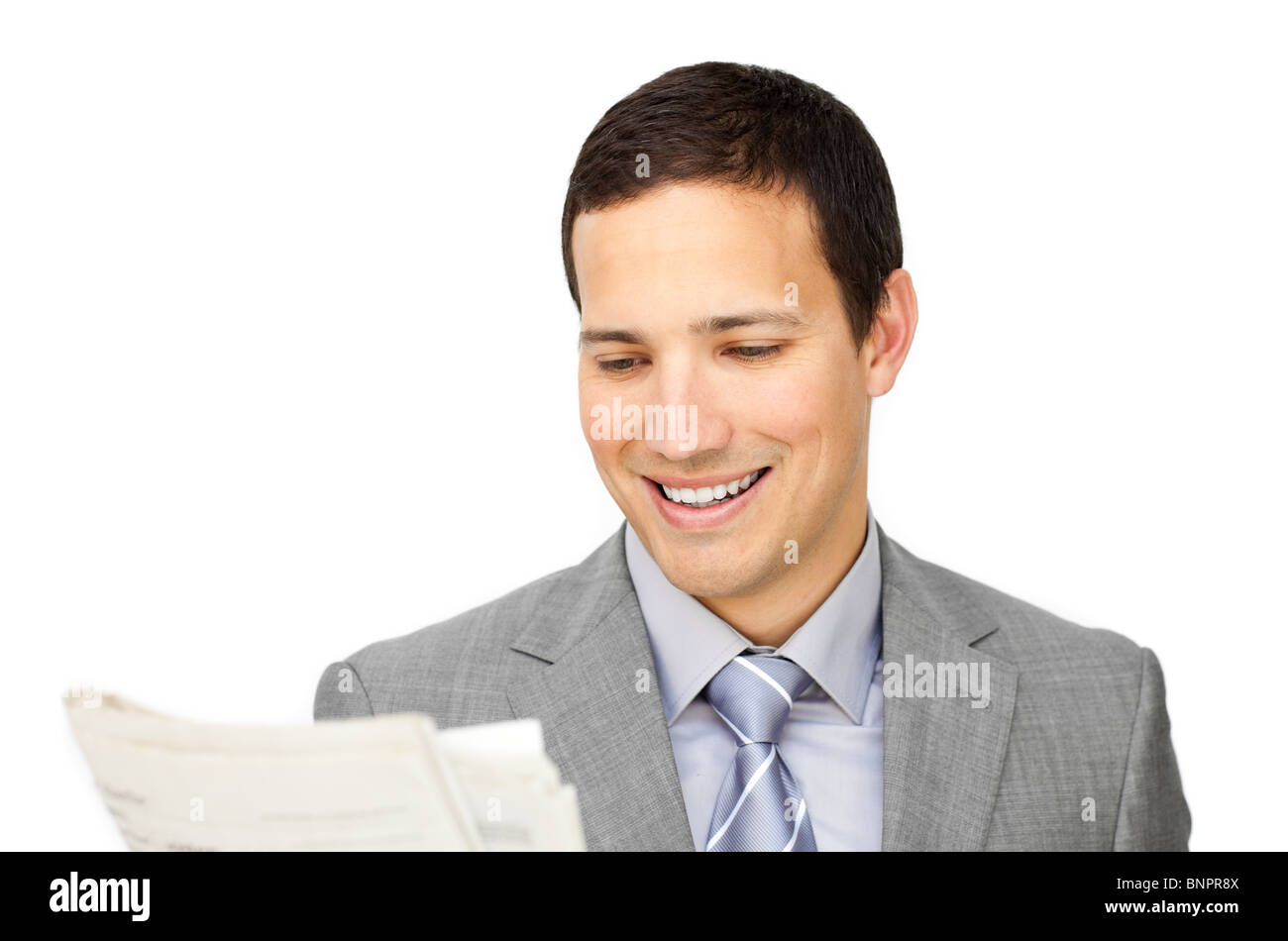 Smiling businessman reading a newspaper Stock Photo - Alamy