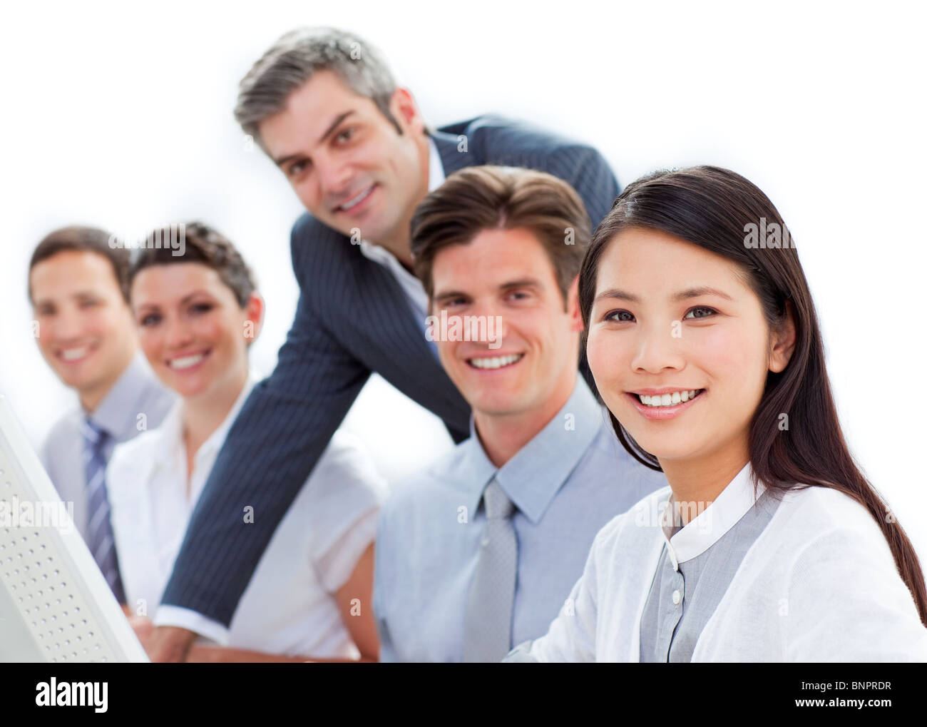Smiling business co-workers working together Stock Photo - Alamy