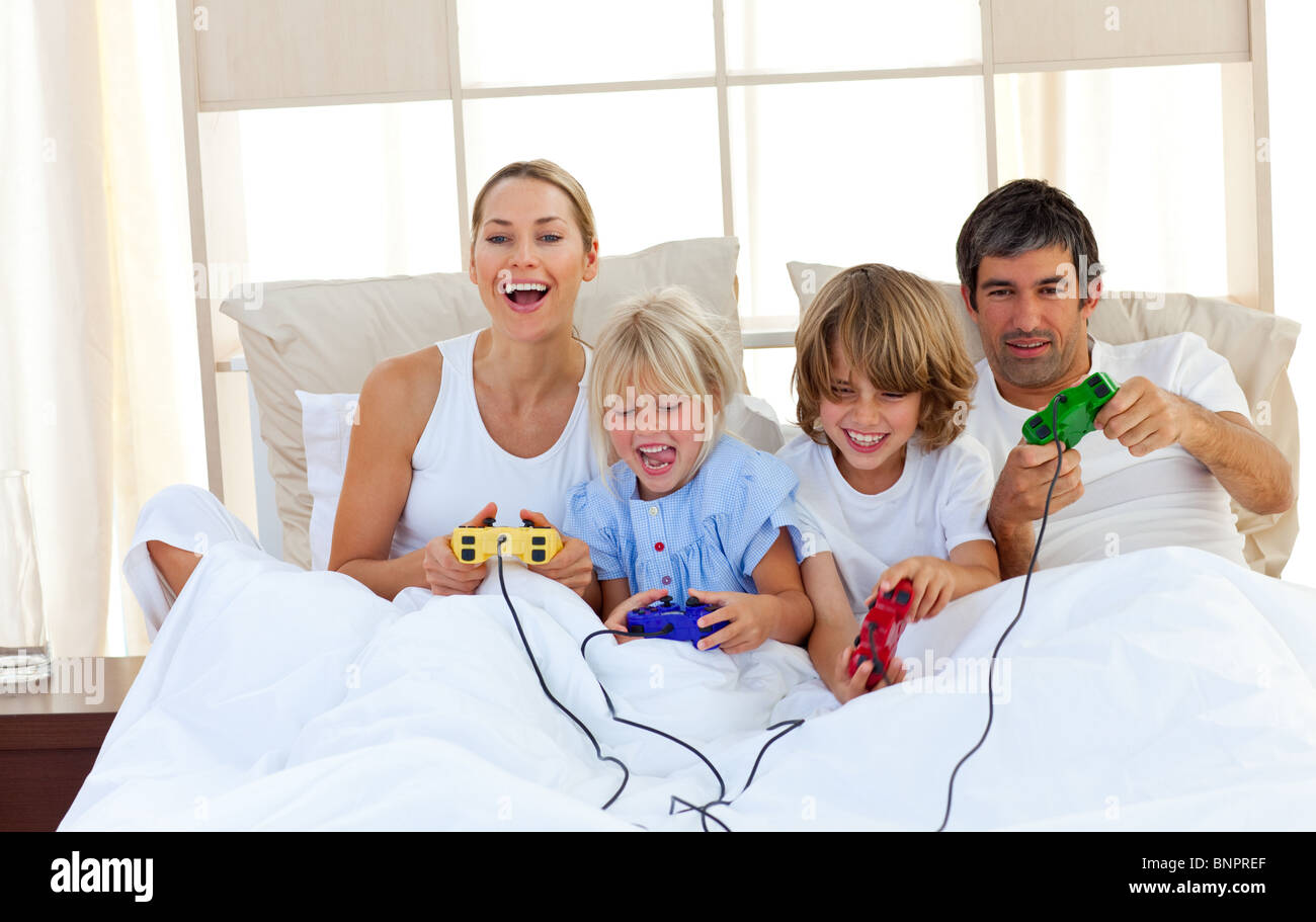 Video game children playing with video games in their bedroom hi-res ...