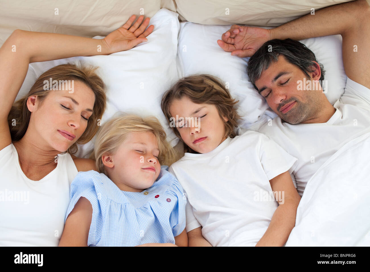 Loving family sleeping together Stock Photo - Alamy