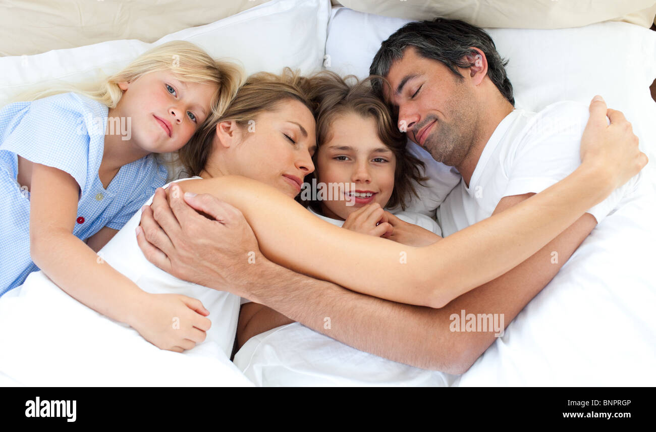 Adorable family relaxing together Stock Photo - Alamy