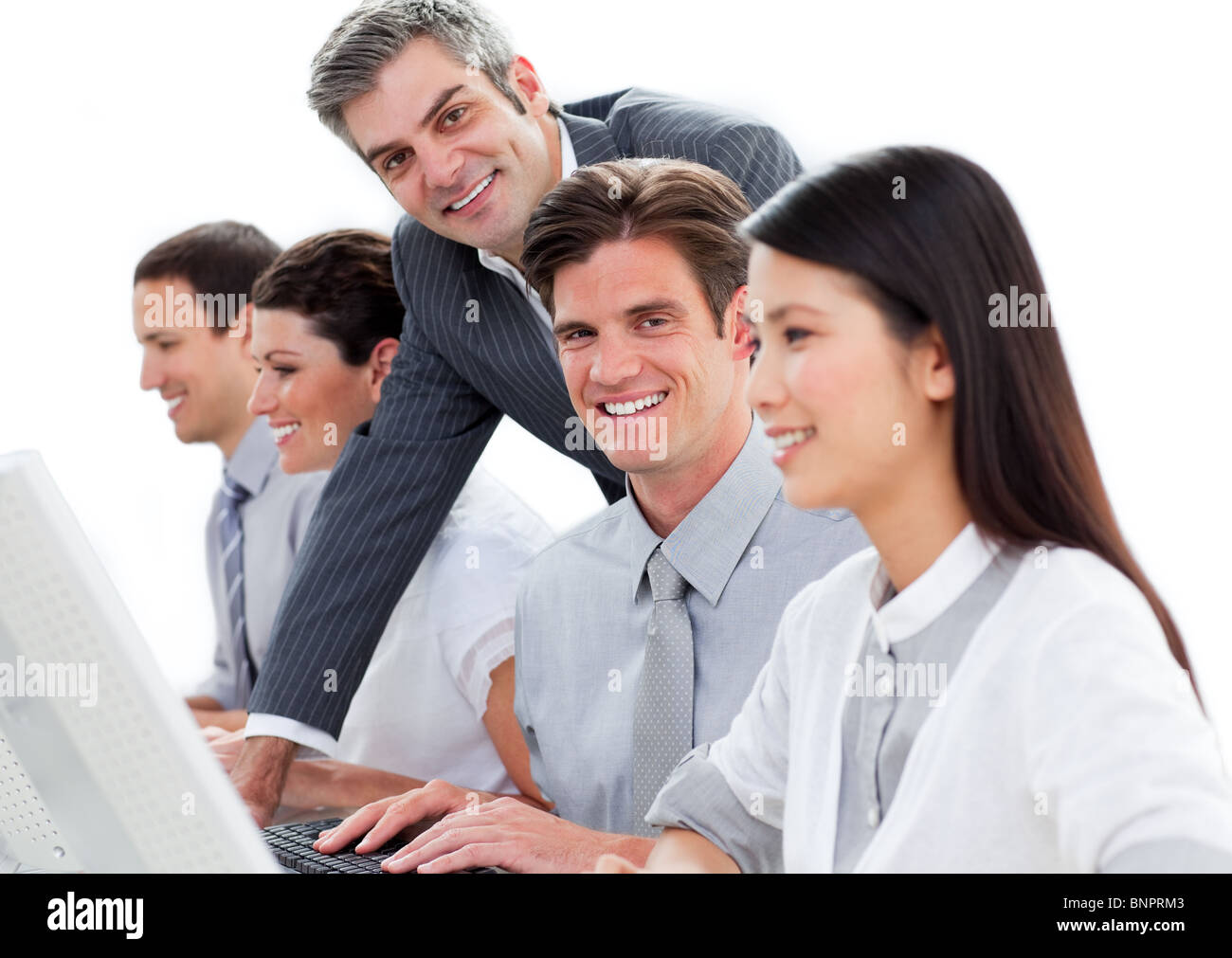 Smiling business partners working together Stock Photo - Alamy