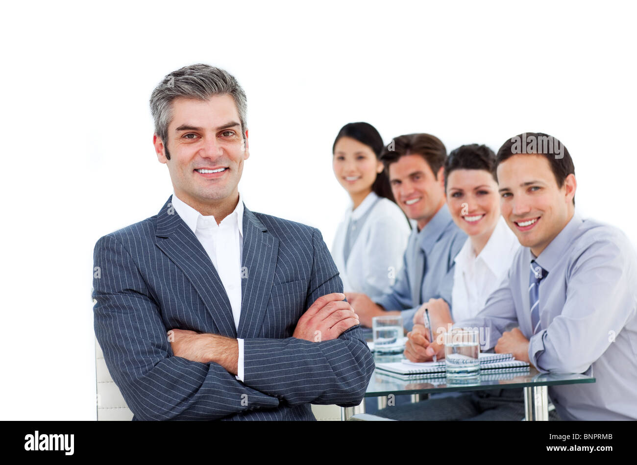 Concentrated business partners working together Stock Photo - Alamy