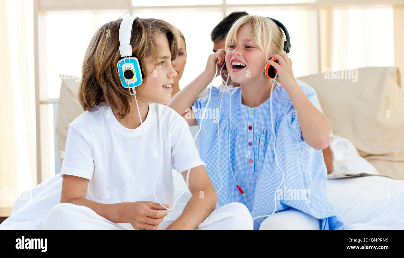 Joyful children having fun and listening music Stock Photo - Alamy