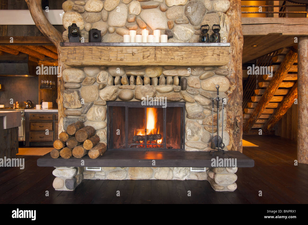 Rustic Fireplace in Log Cabin Stock Photo - Alamy
