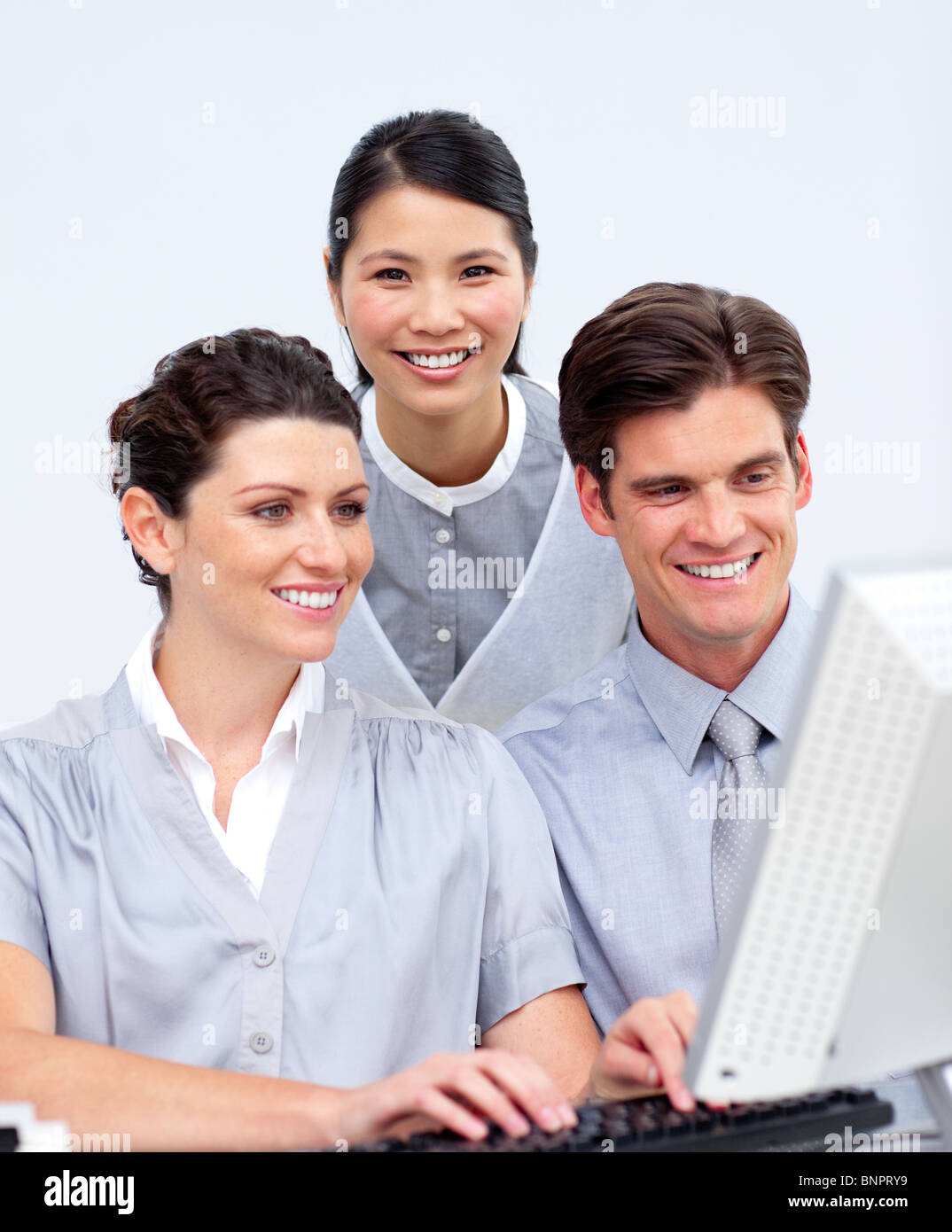 Ambitious business people working at a computer Stock Photo - Alamy