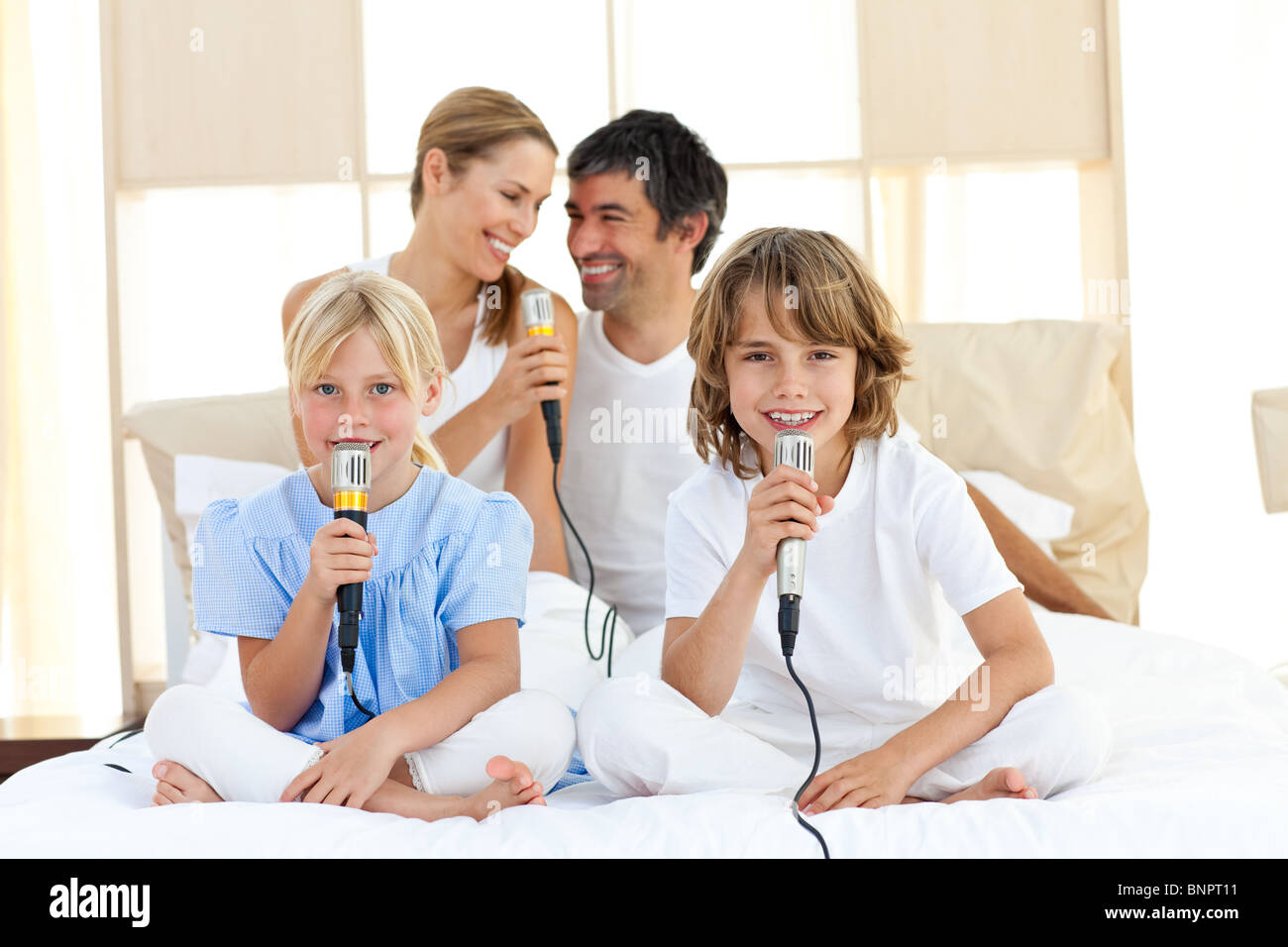 Affectionate family singing together Stock Photo - Alamy