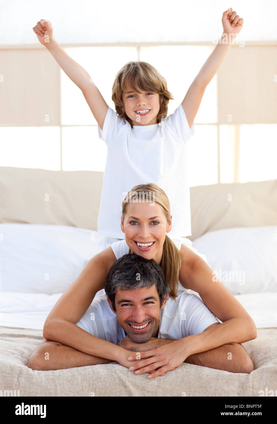 Happy boy playing with his parents Stock Photo - Alamy