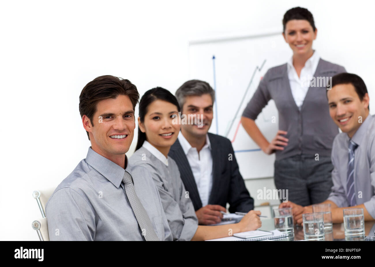 Smiling international business people at a presentation Stock Photo - Alamy