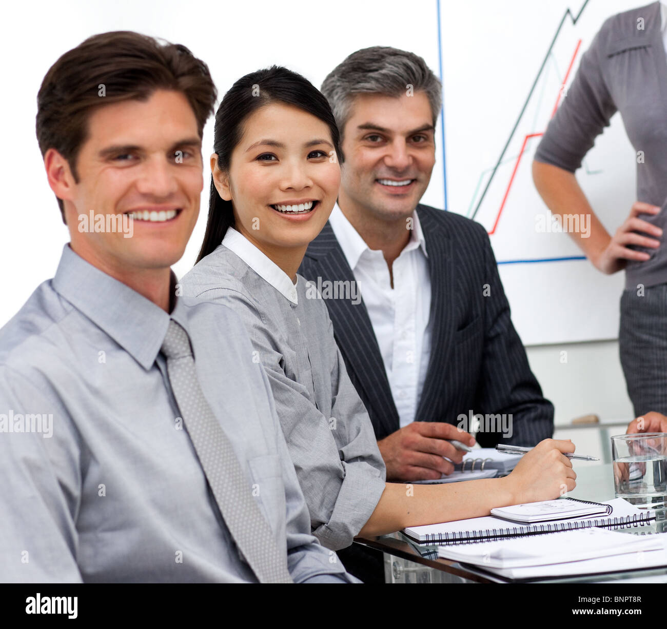 Confident business people at a presentation Stock Photo - Alamy
