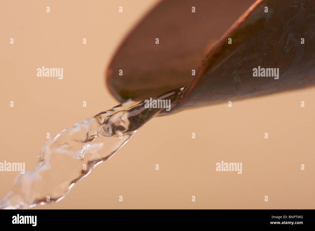 Custom Copper Faucet and Water Close-up Stock Photo - Alamy