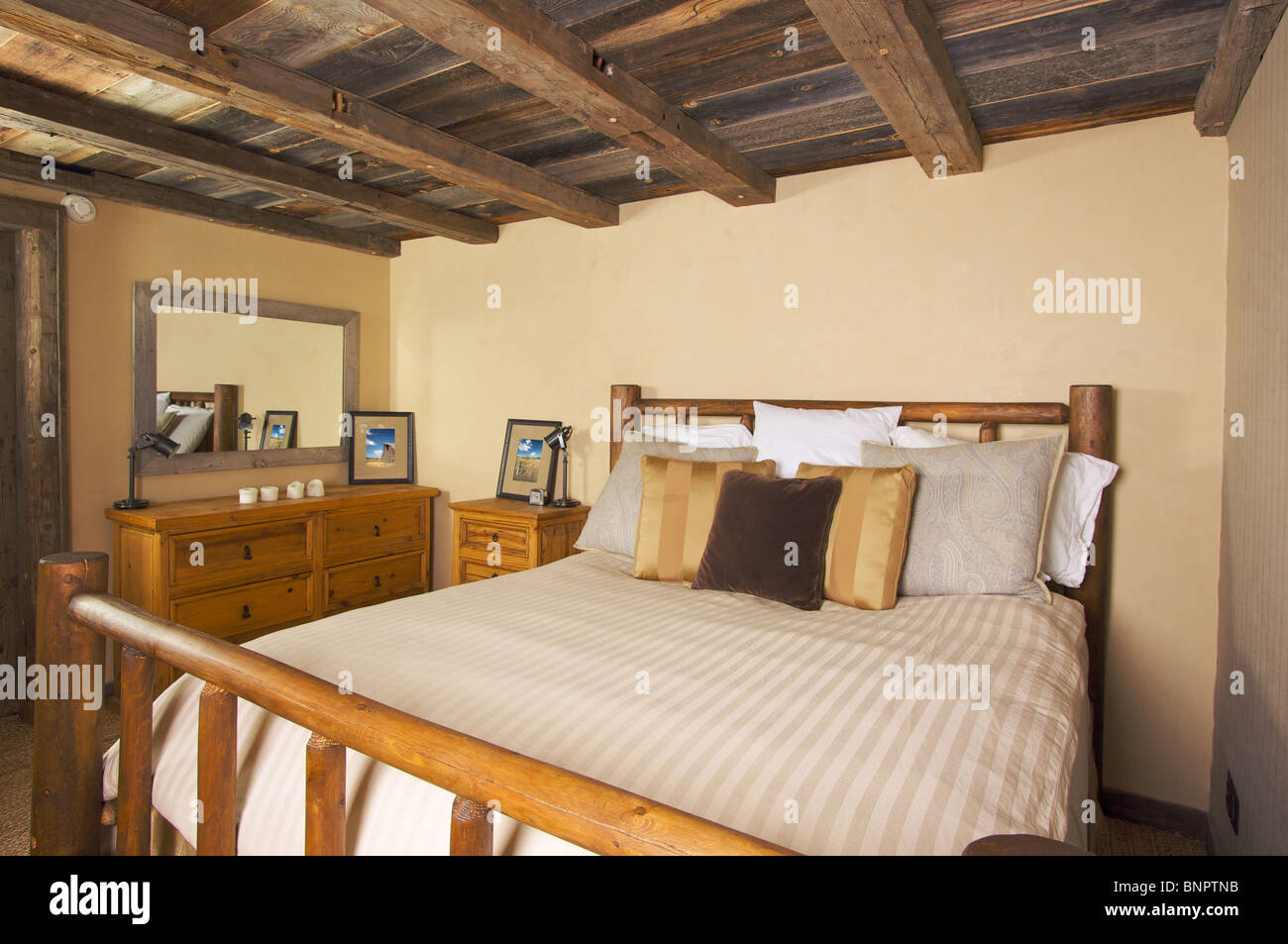 Luxurious Rustic Log Cabin Bedroom in a Rural Setting Stock Photo - Alamy