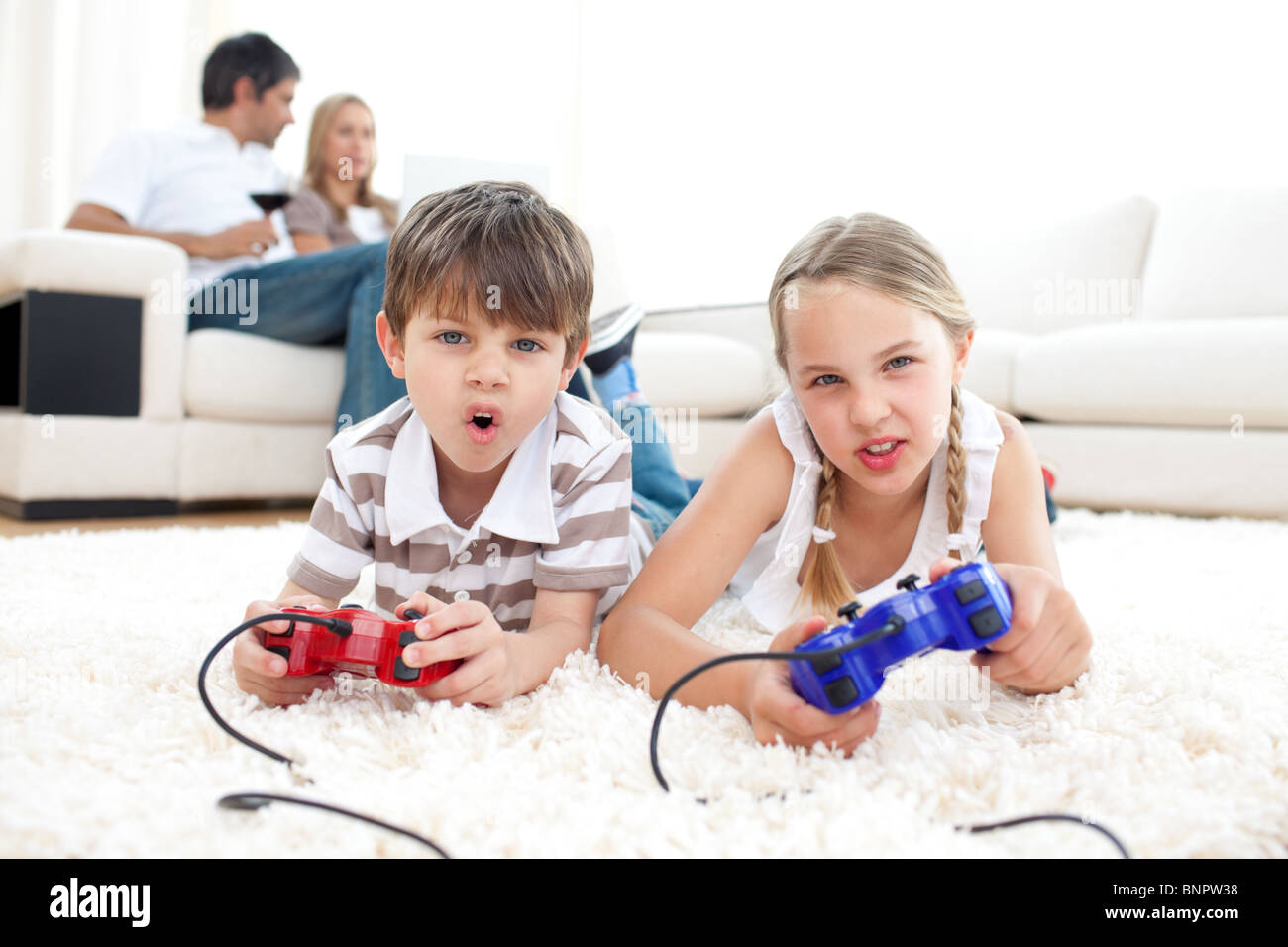 Lively children playing video games Stock Photo - Alamy