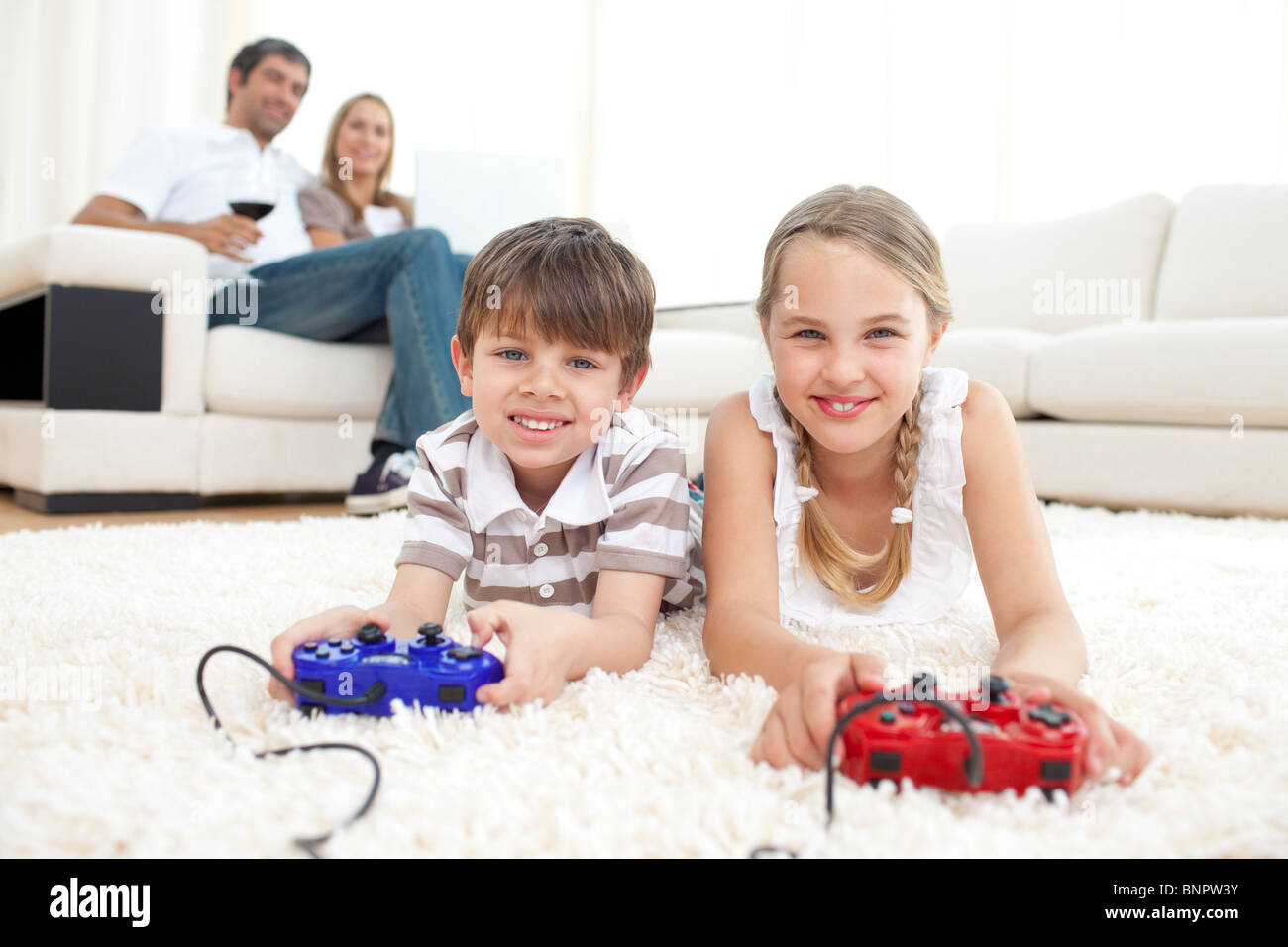 Brother and sister playing video games Stock Photo - Alamy