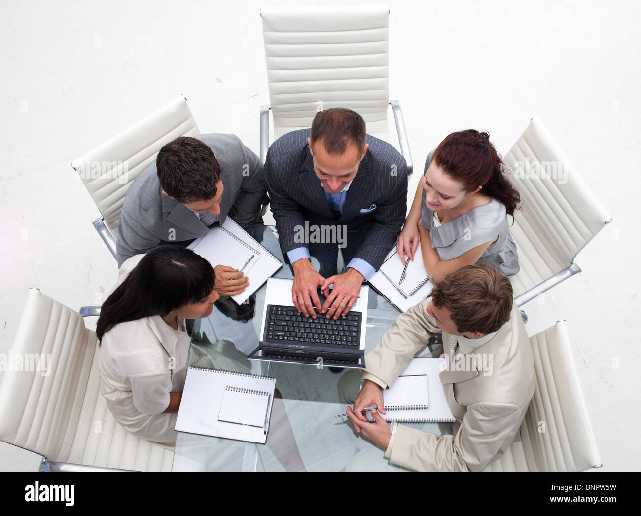 High angle of business team working together in an office Stock Photo ...