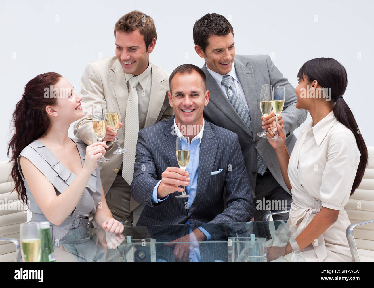 Happy team celebrating work toast hi-res stock photography and images ...