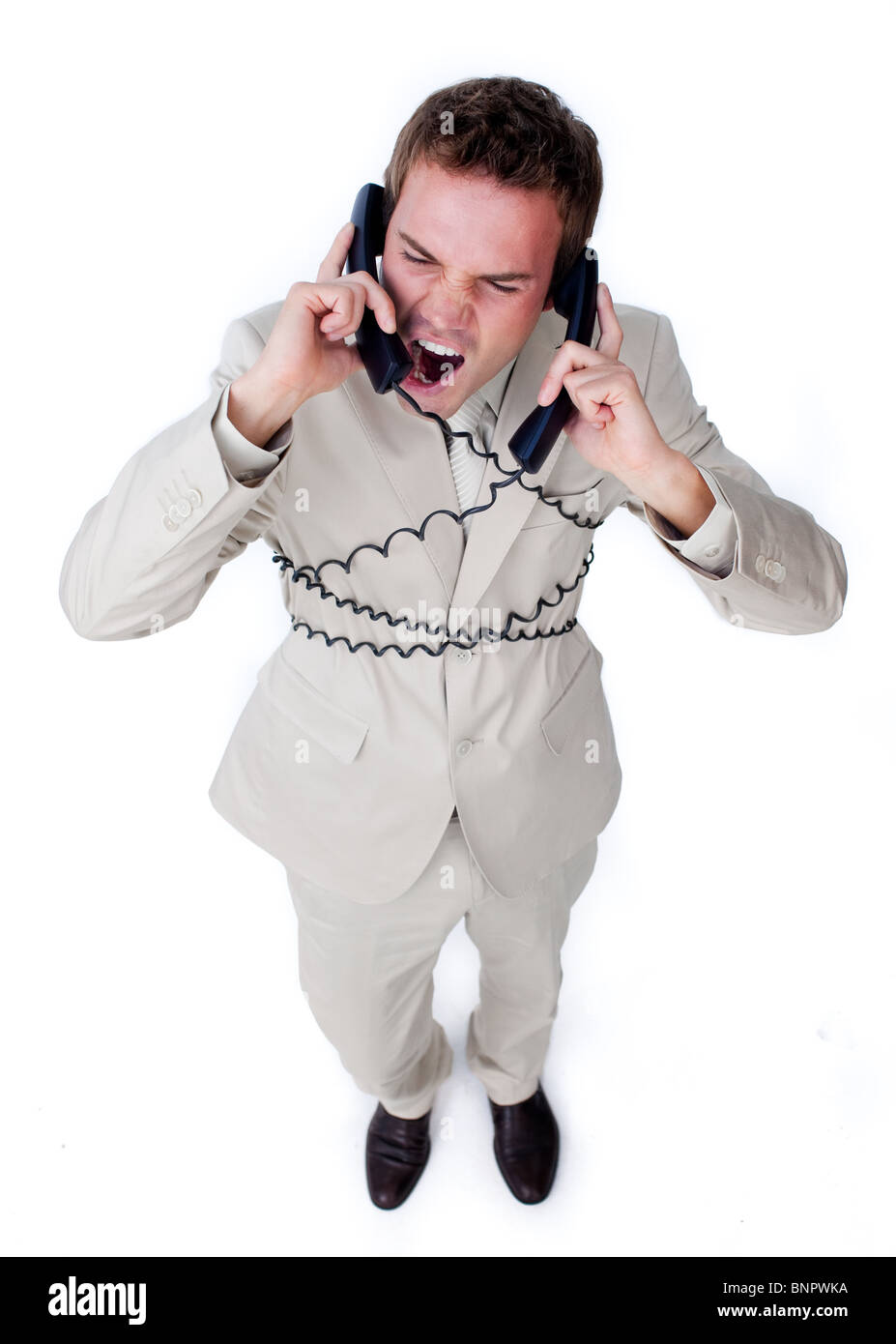 Tired businessman having a phone call Stock Photo - Alamy