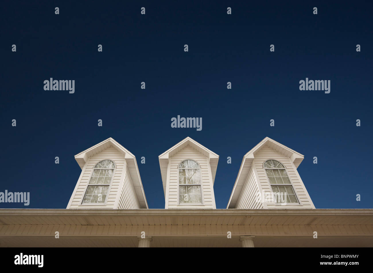 House Roof and Windows Against a Deep Blue Sky Stock Photo - Alamy
