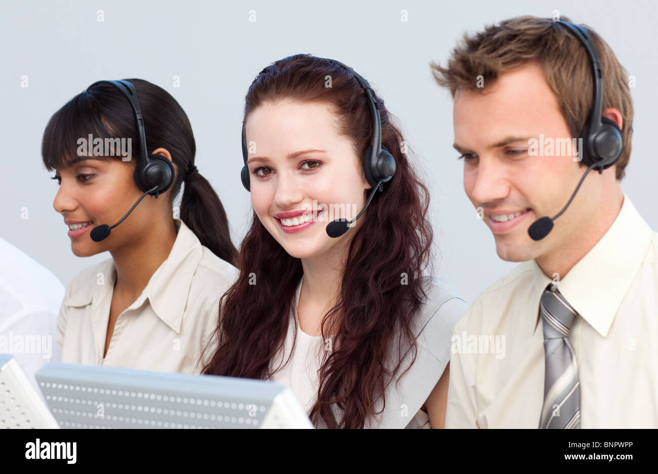Beautiful woman working with her team in a call center Stock Photo - Alamy