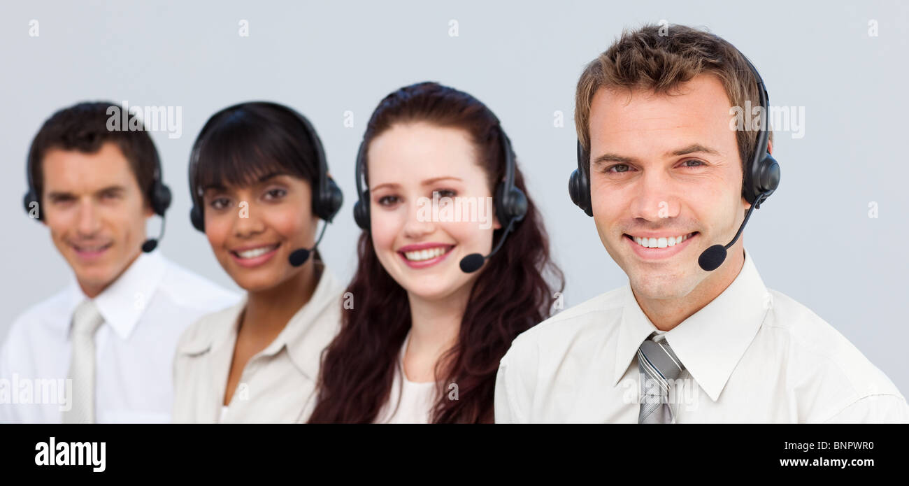 Smiling team working in a call center Stock Photo - Alamy
