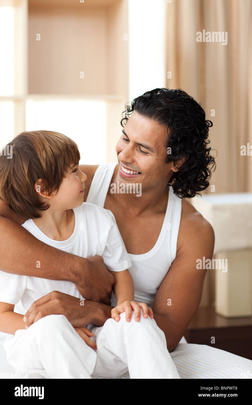 Attractive man hugging his son Stock Photo - Alamy