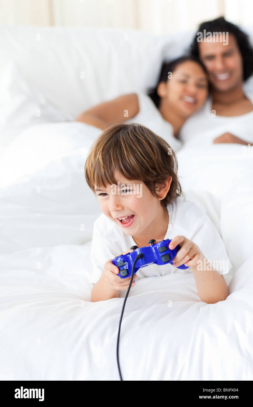Cute little boy playing video games Stock Photo - Alamy