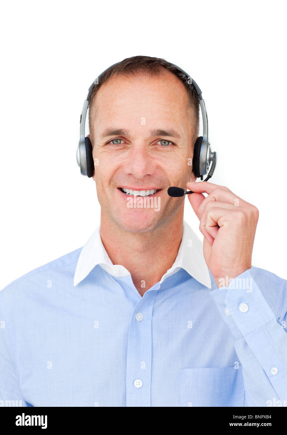 Handsome businessman using headset Stock Photo - Alamy