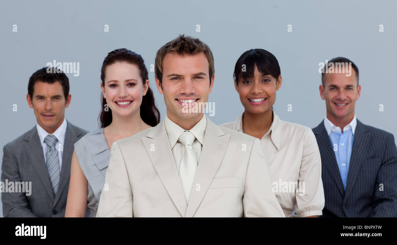 Happy business team smiling Stock Photo - Alamy
