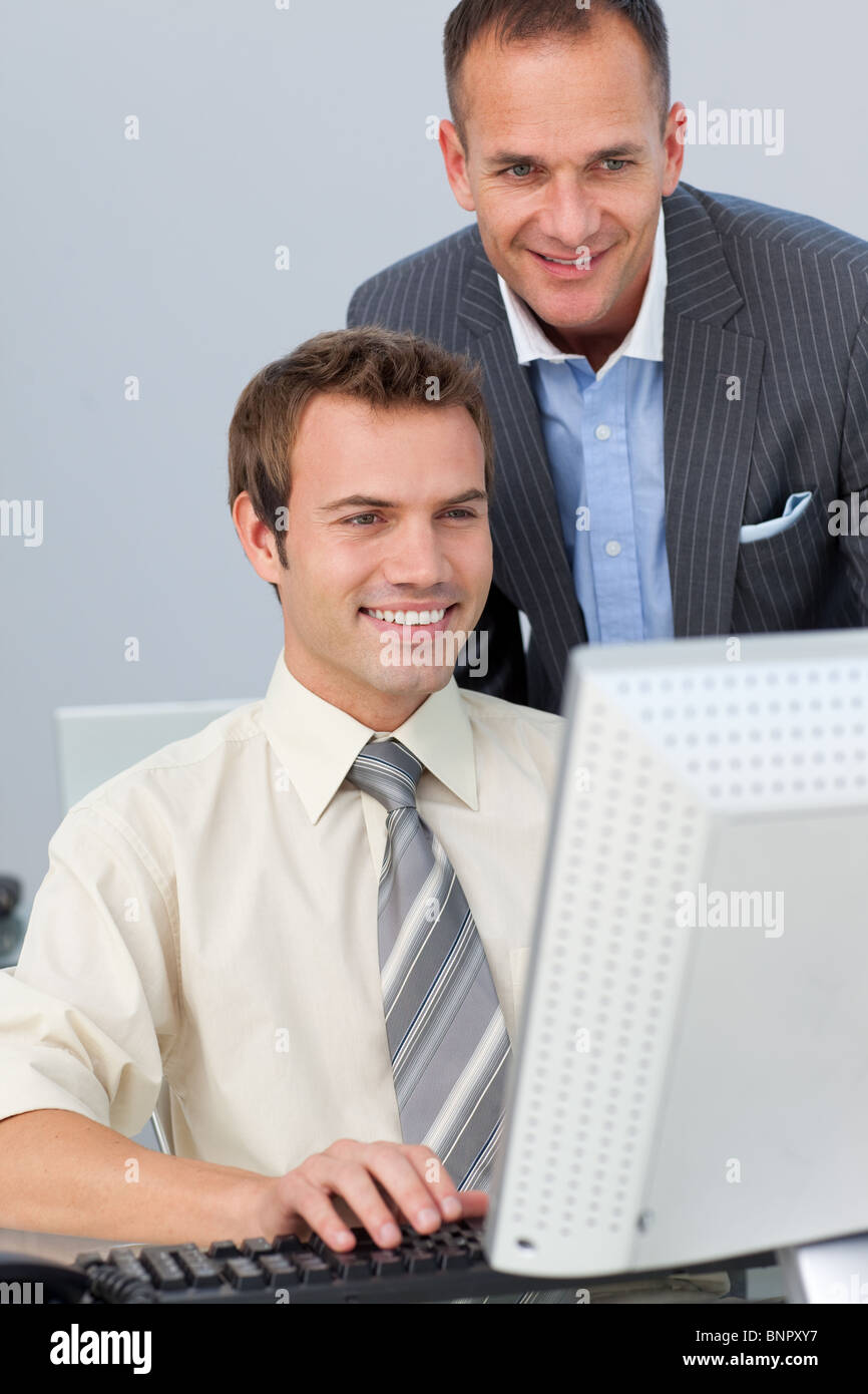 Mature manager checking his employee's work Stock Photo - Alamy